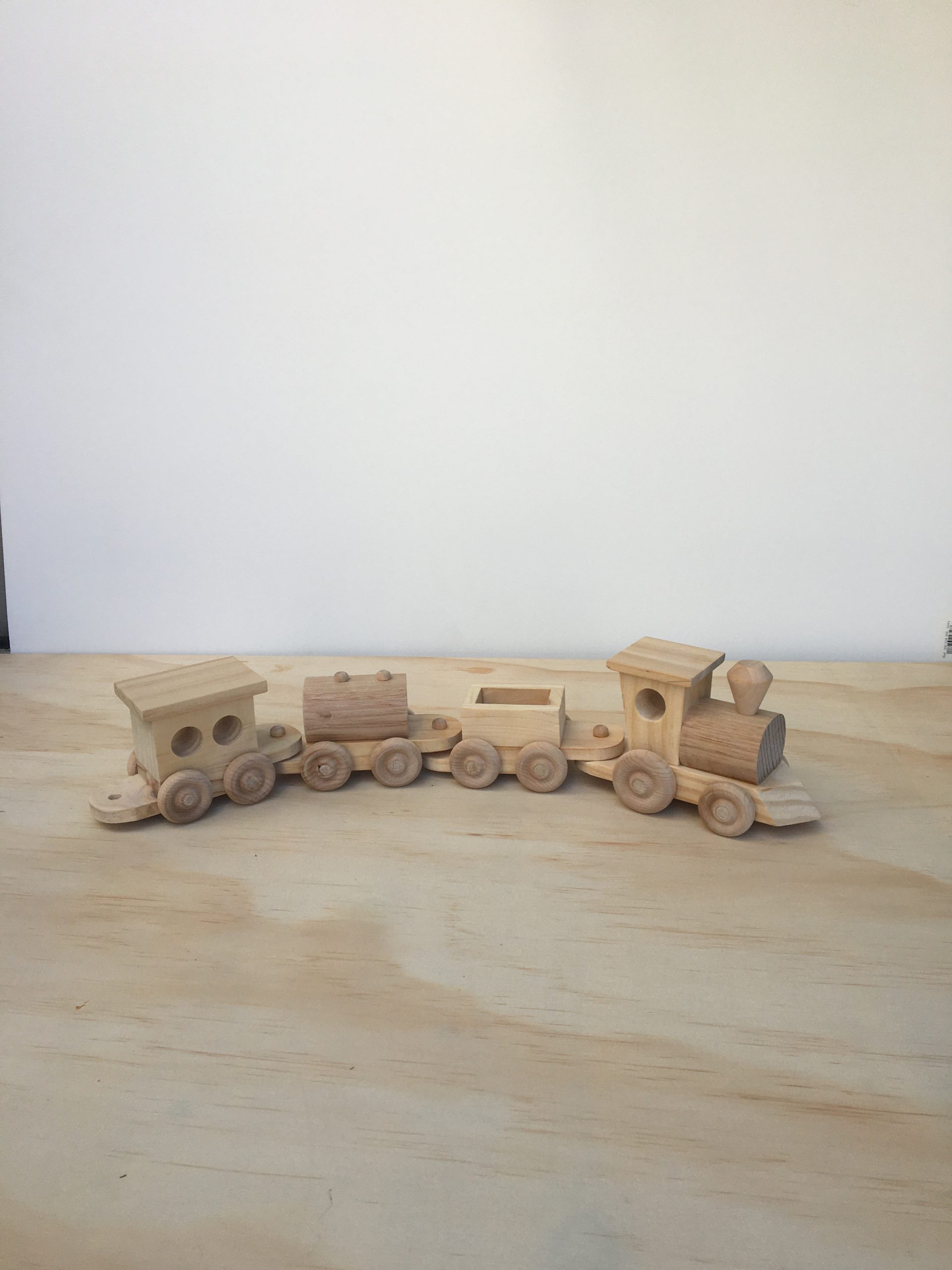 All wooden toy train set with steam locomotive and three carriages ...